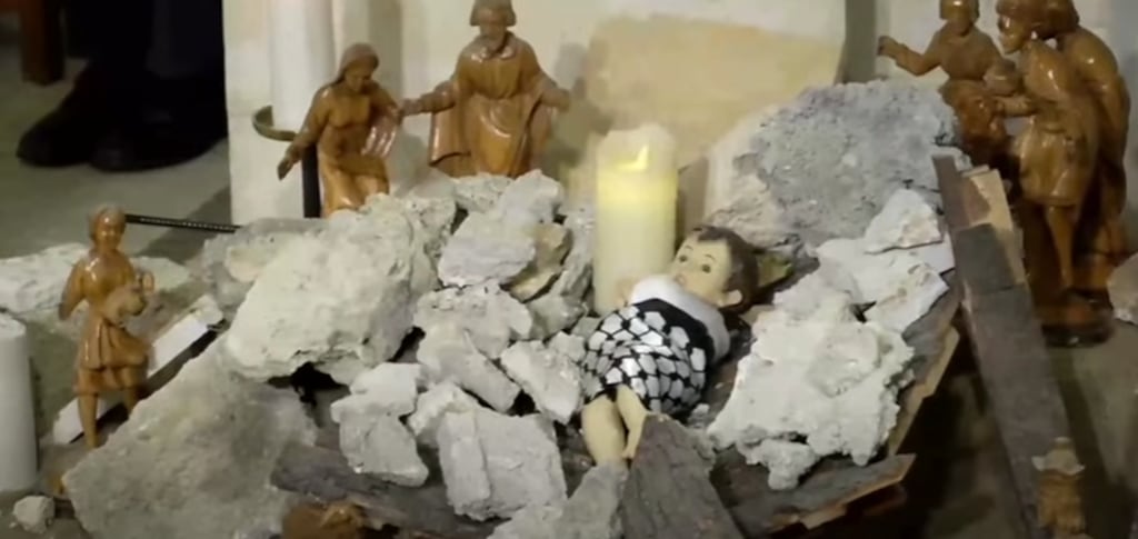 Israel continues bombing as symbolic Baby Jesus in a manger of rubble ...